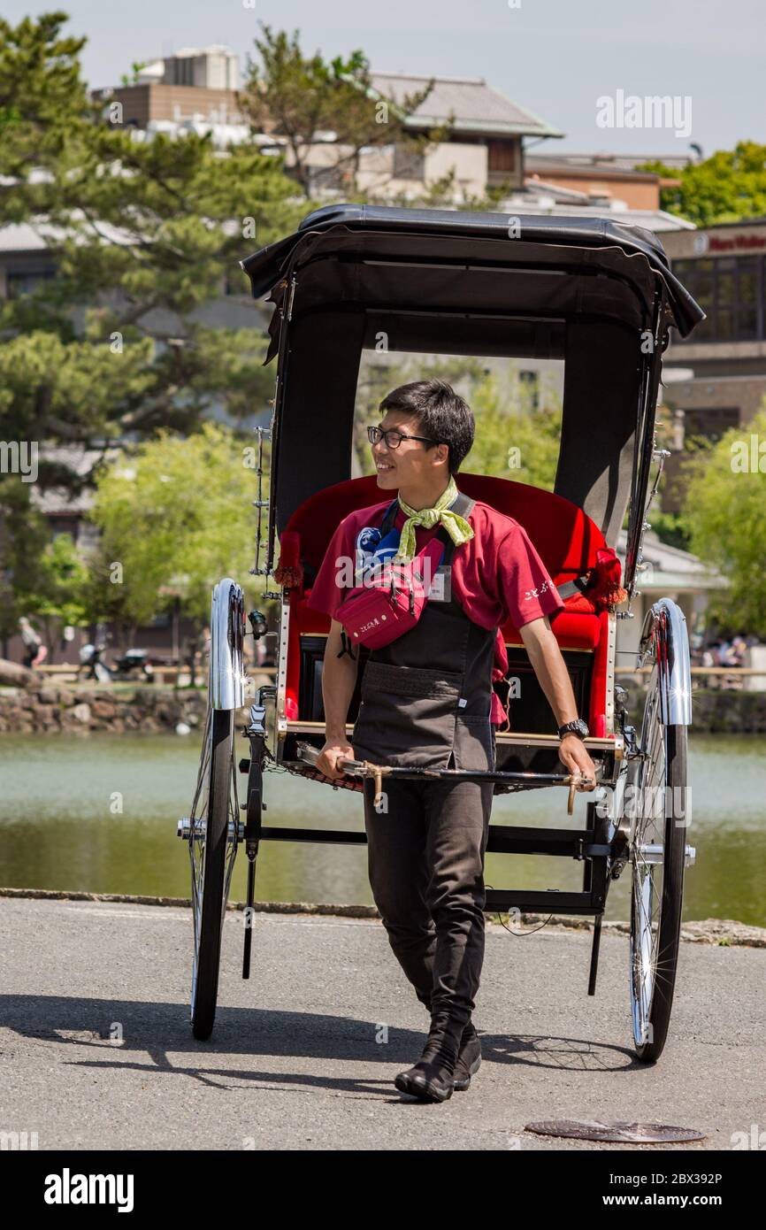 Nara / Japan - May 12, 2018: Young Japanese rickshaw puller in Nara ...