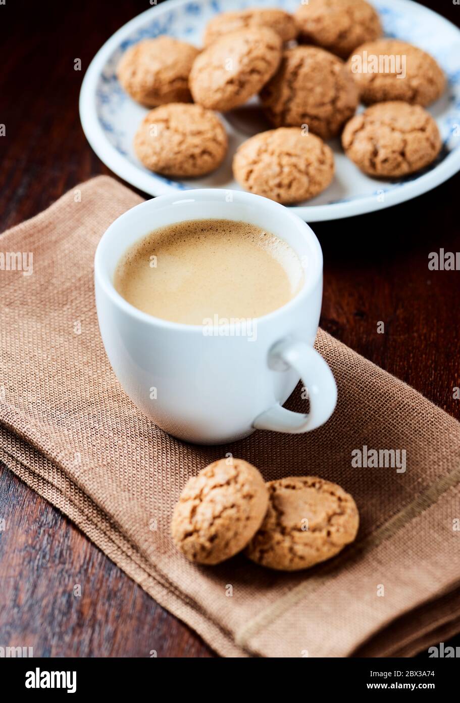 Cup of coffee with amaretti (Italian biscuits) on rustic wooden ...