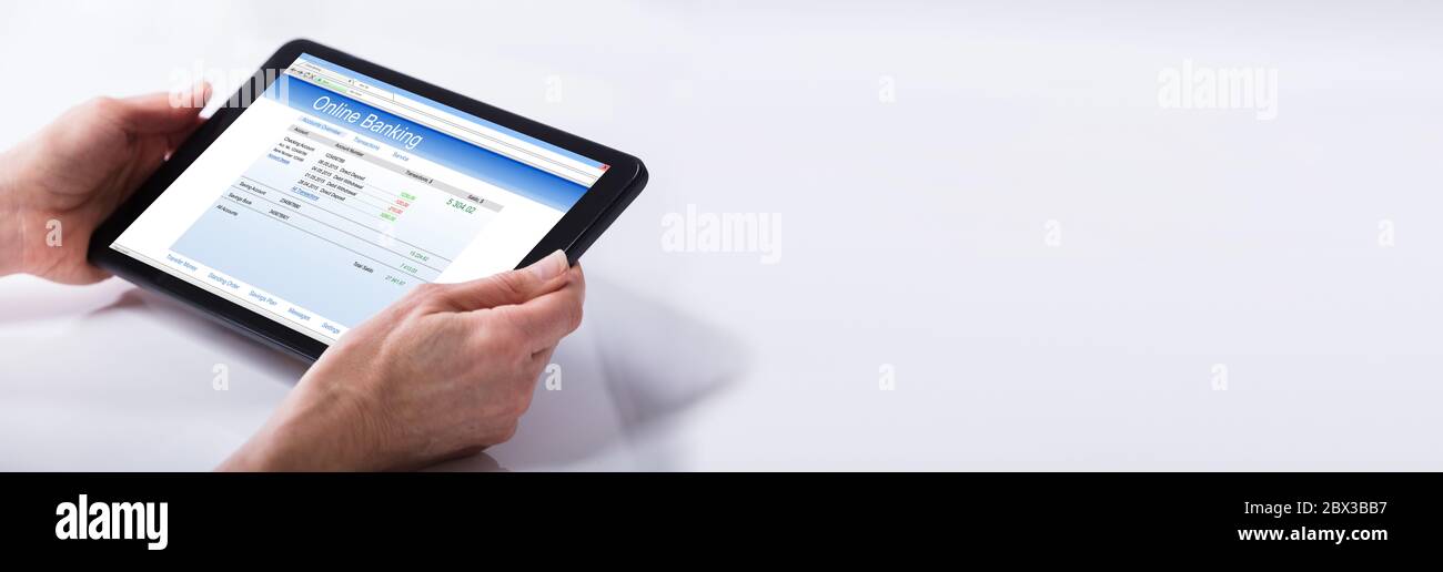 Person Using Online Banking On Tablet Computer Stock Photo - Alamy