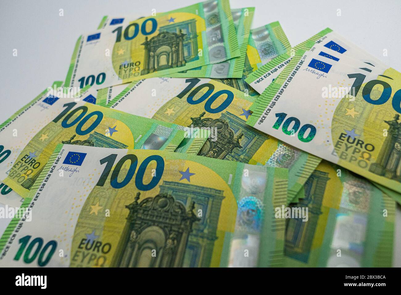 Symbol image - 100-euro notes on a white background Stock Photo - Alamy