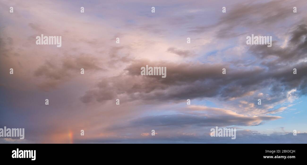 Summer sunset after rain sky panorama with fleese purple clouds and ...