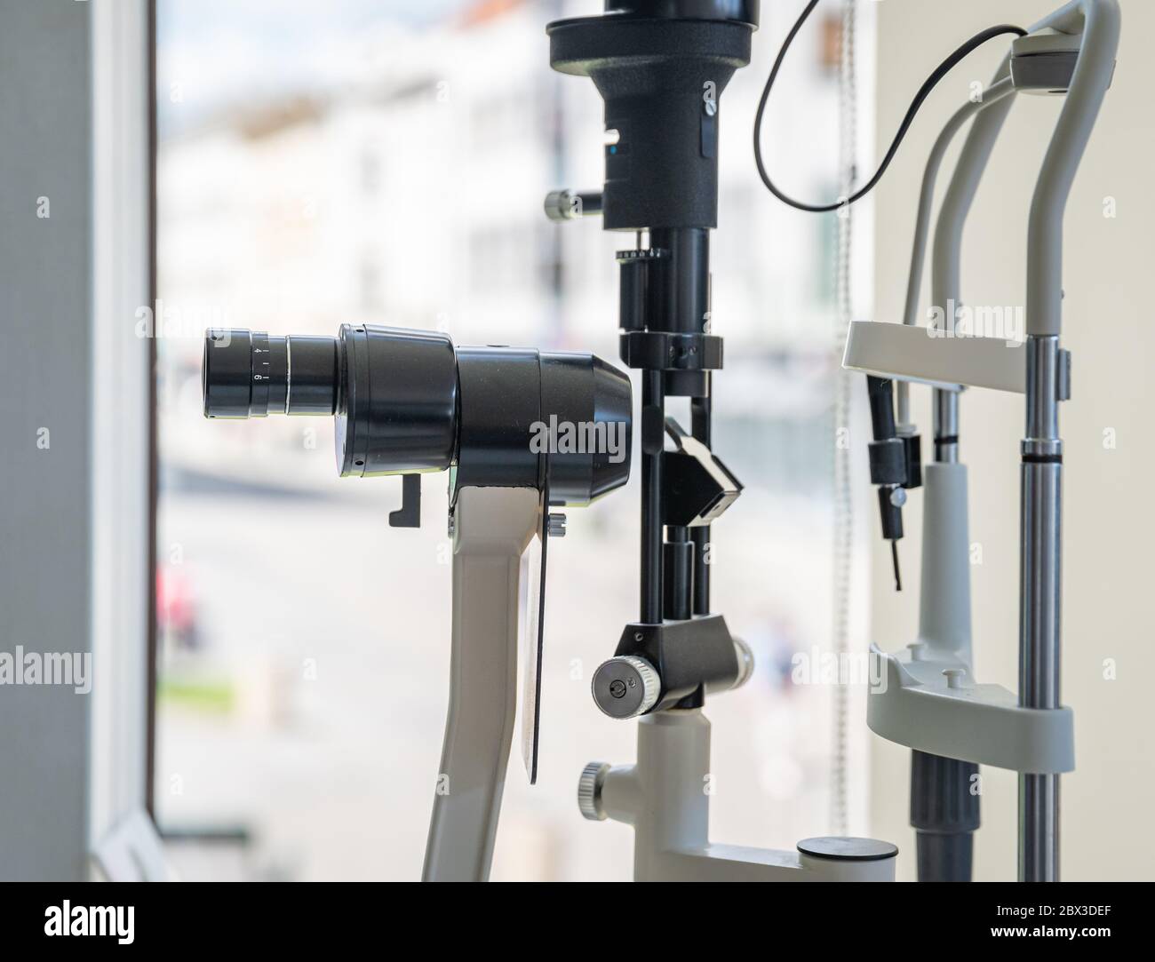 microscope for eye examination in hospital, optometrist Stock Photo - Alamy