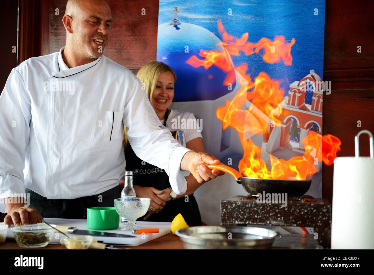 SANTORINI, GREECE - MAY 18: The cooking of traditional Greek dishes by ...