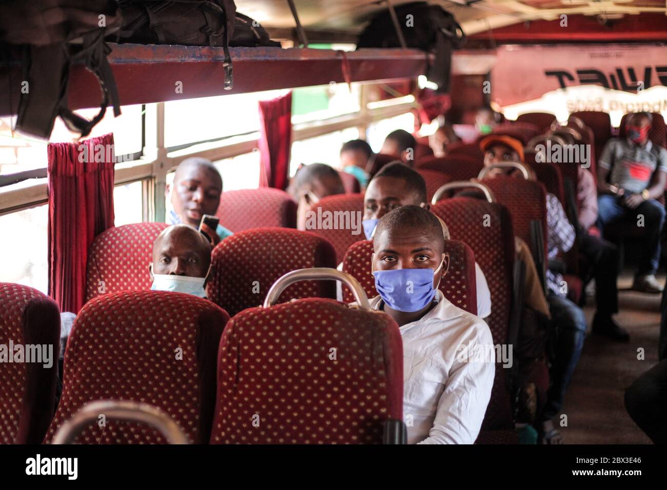 Kampala, Uganda. 4th June, 2020. Passengers are seated in a bus with ...
