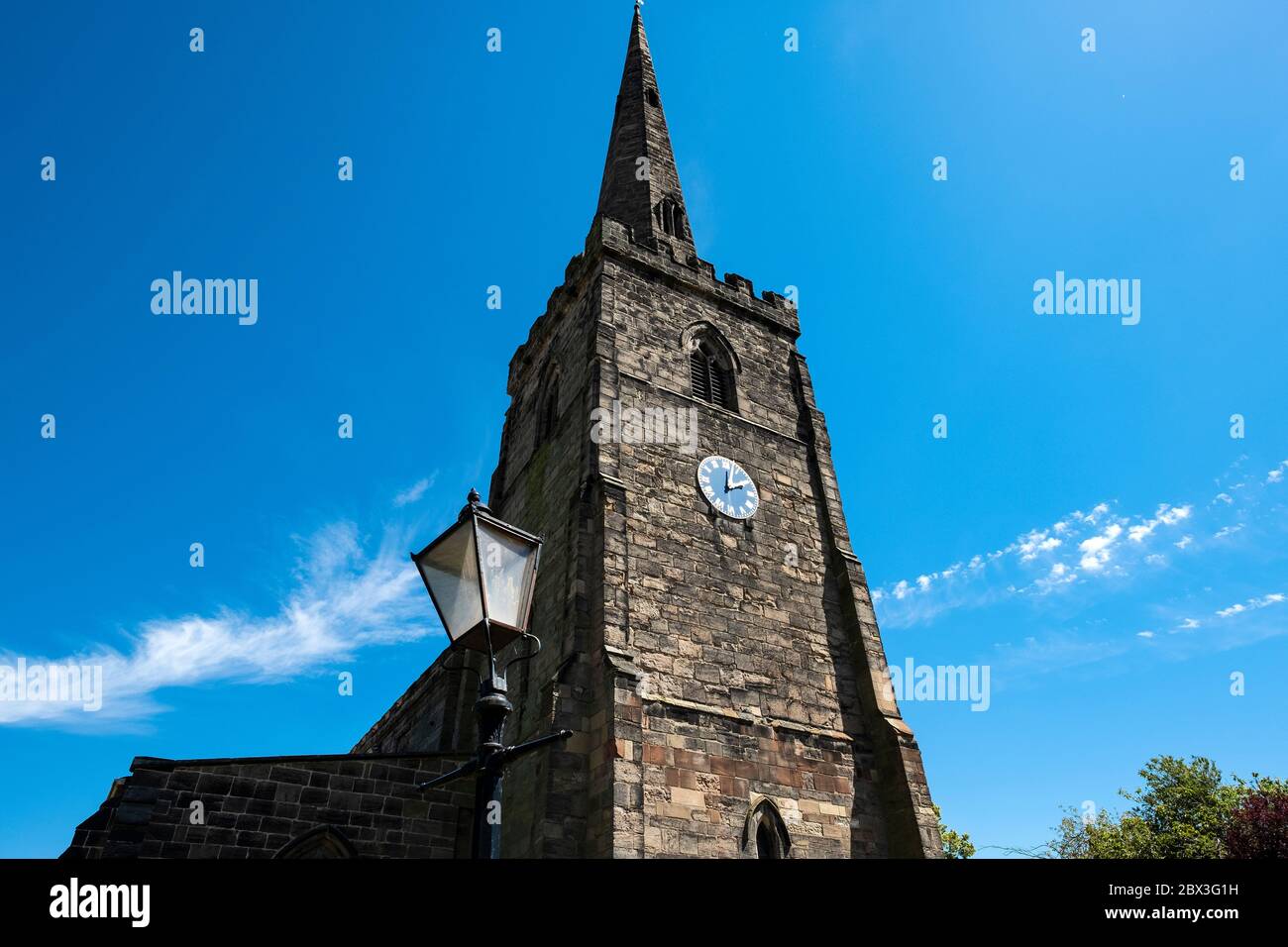 Tall pointed village church steeple Stock Photo - Alamy