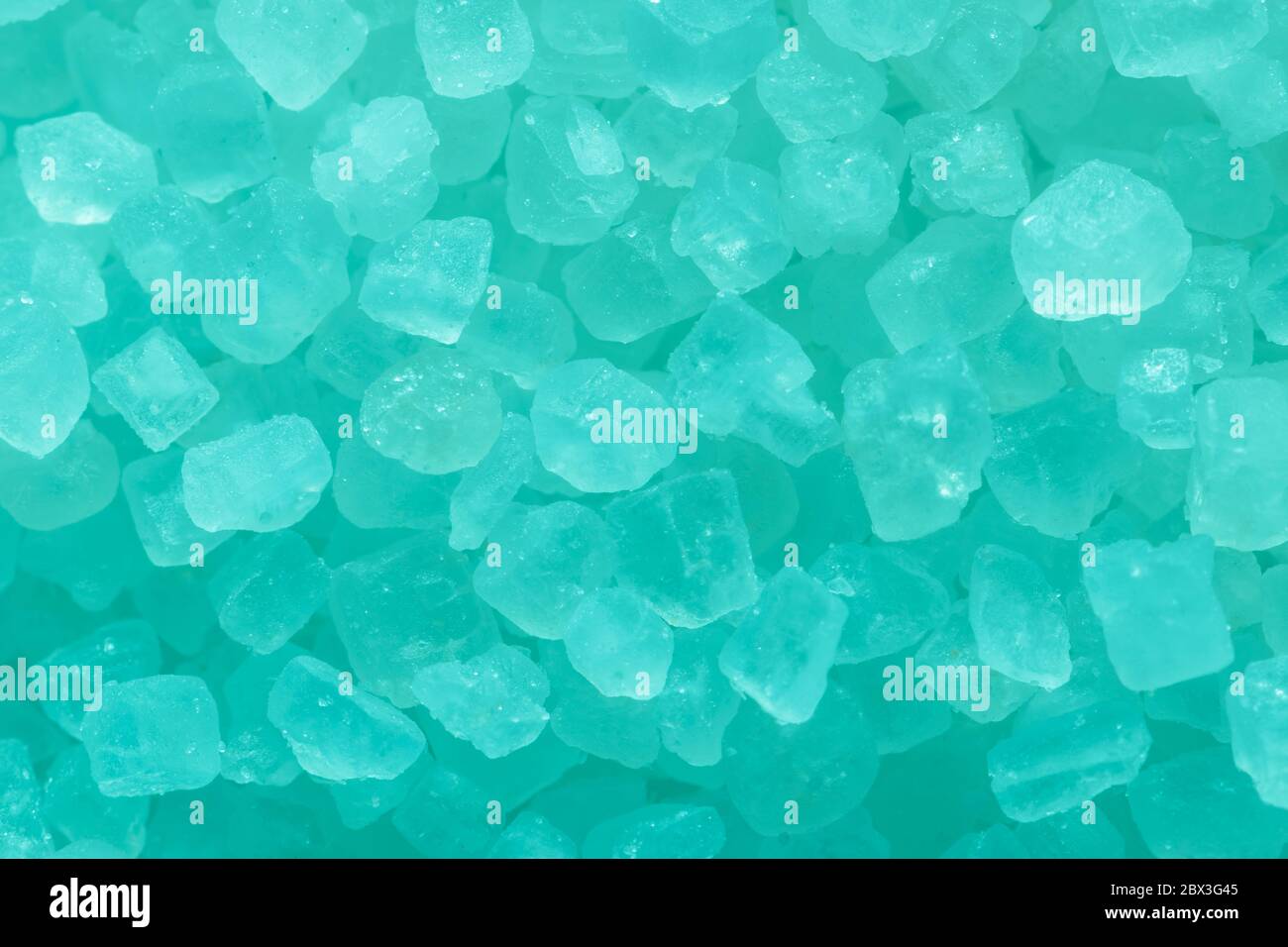 Green bath aroma salt crystal grains closeup. Template for labels and ...