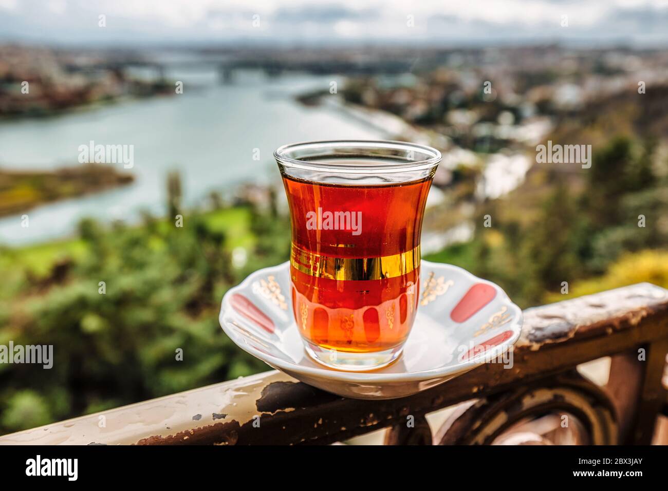 Cup of classic turkish tea overlooking city from cafe Lotti, Istanbul ...