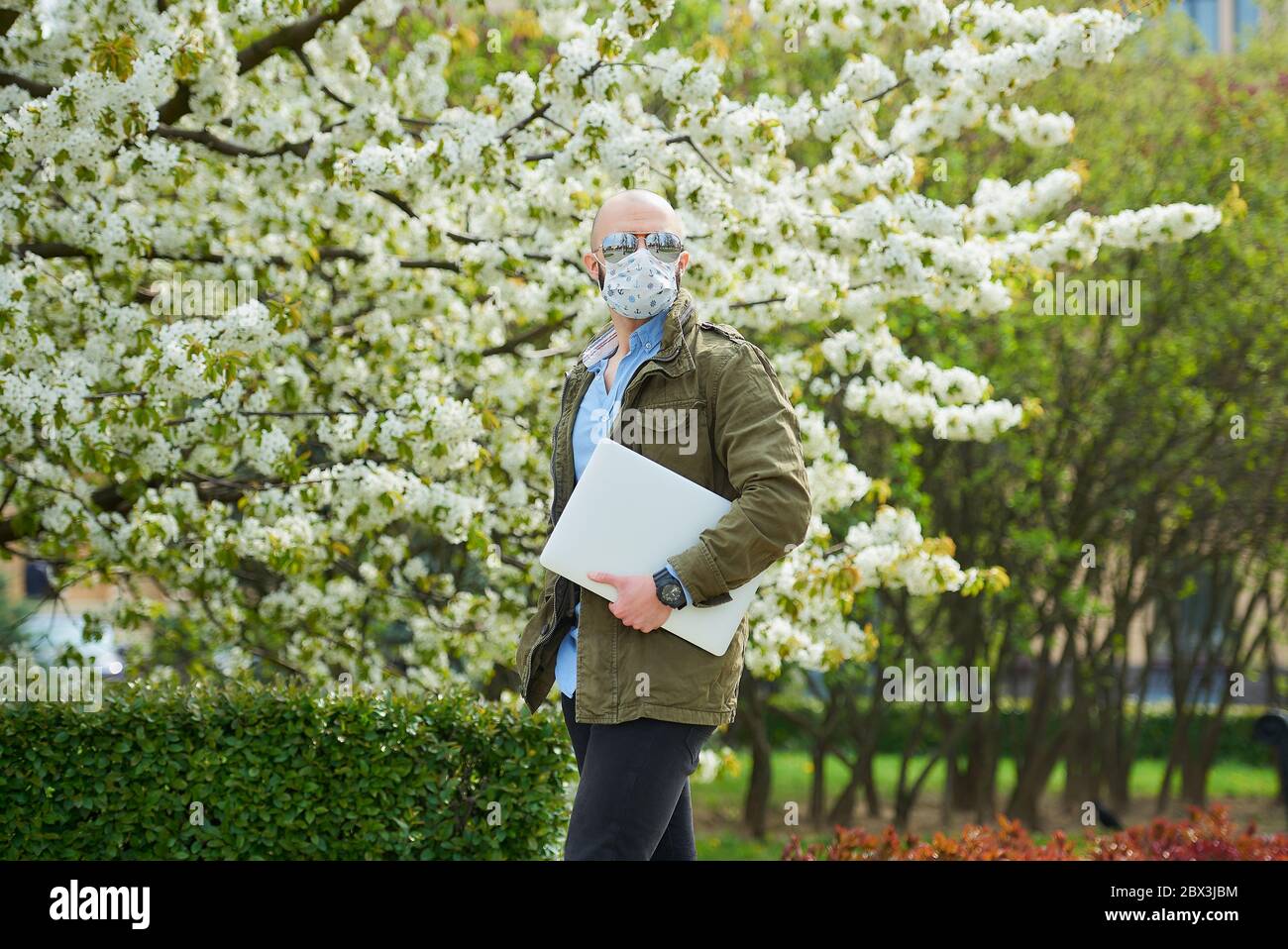 A bald man with a beard in a medical face mask to avoid the spread ...