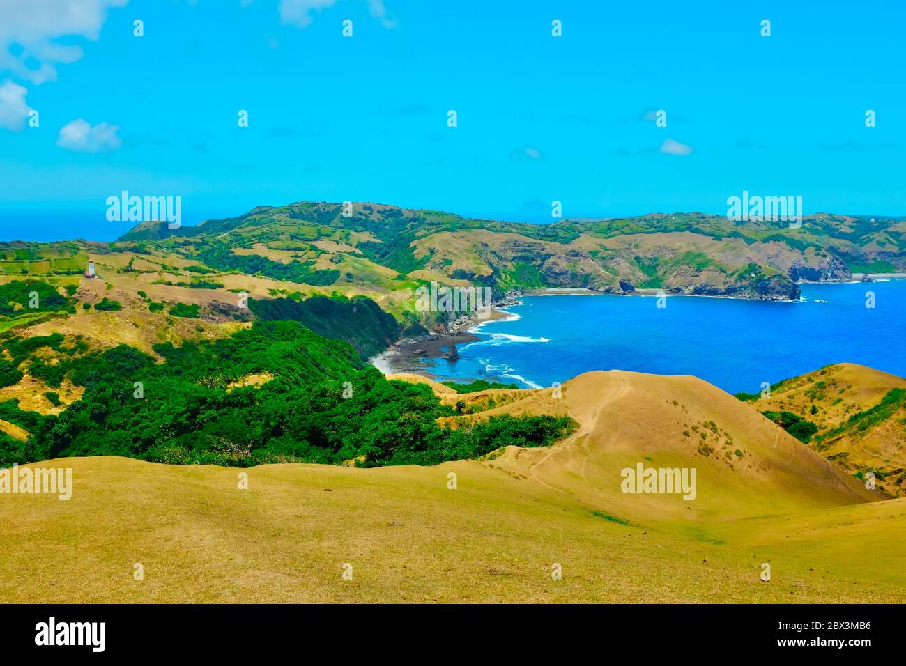 Golden grass field of Marlboro hills in Batanes, Philippines. Beautiful ...
