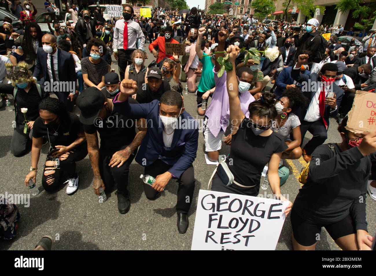 New York City, USA, 06/04/2020. Marchers take a knee for a moment of ...