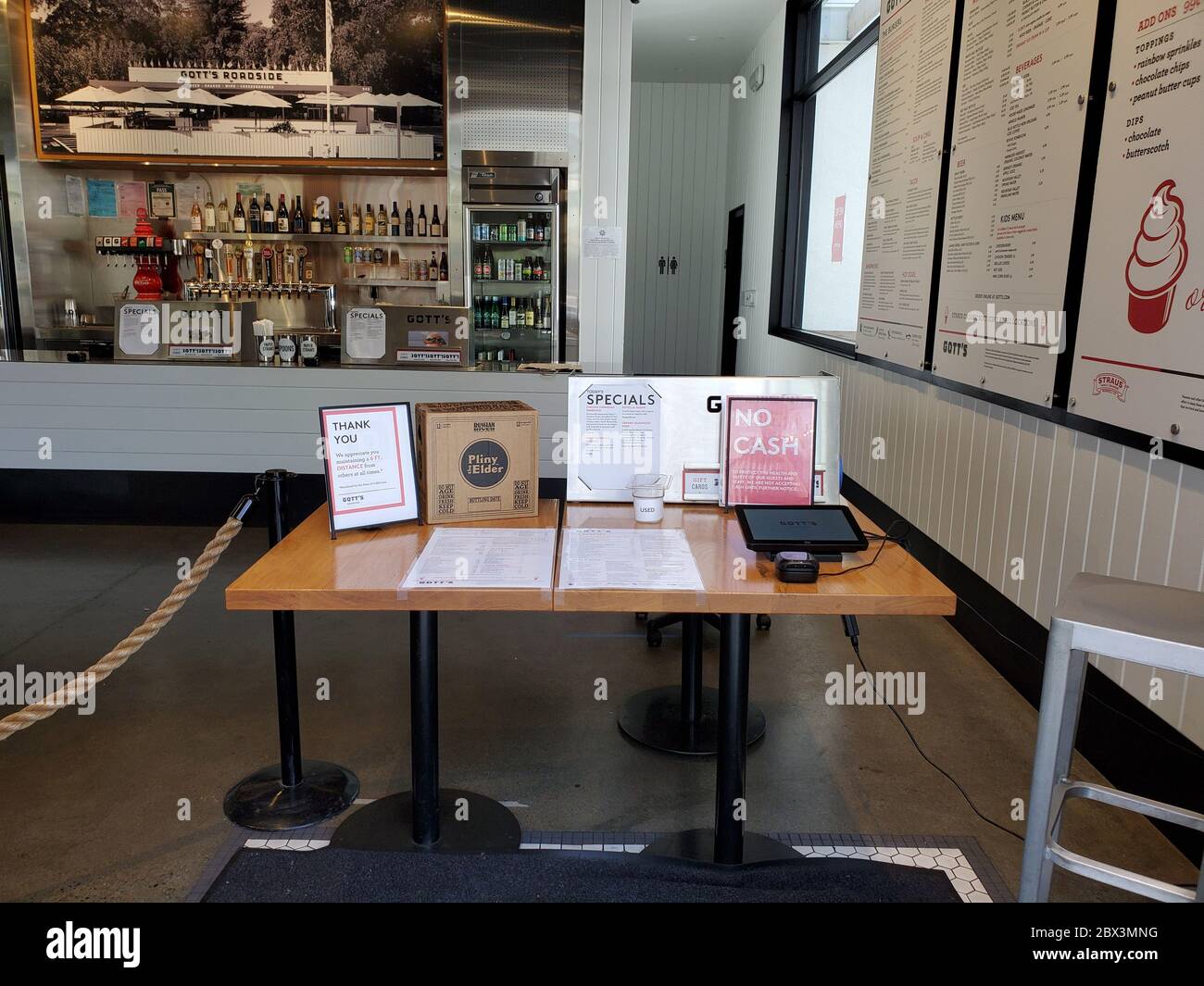 The interior of a restaurant is closed, with the restaurant taking togo ...