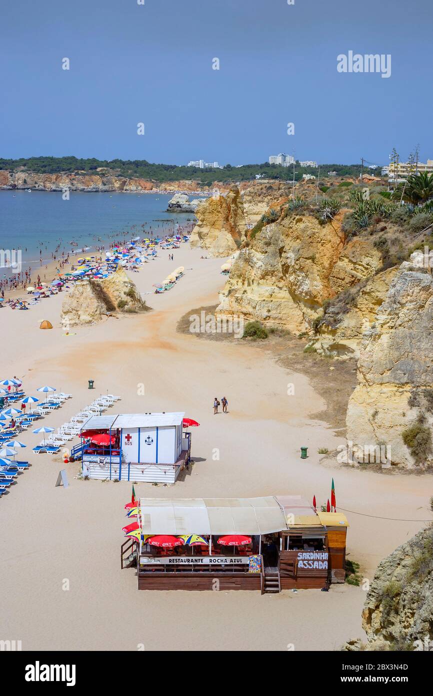 View of Praia da Rocha beach at Portimao with sunbeds, loungers and ...