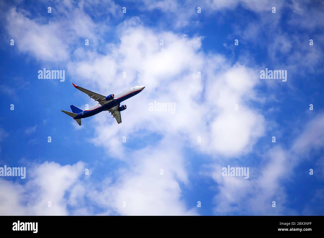 Passenger commercial plane in flight. The aircraft flies airplane a ...