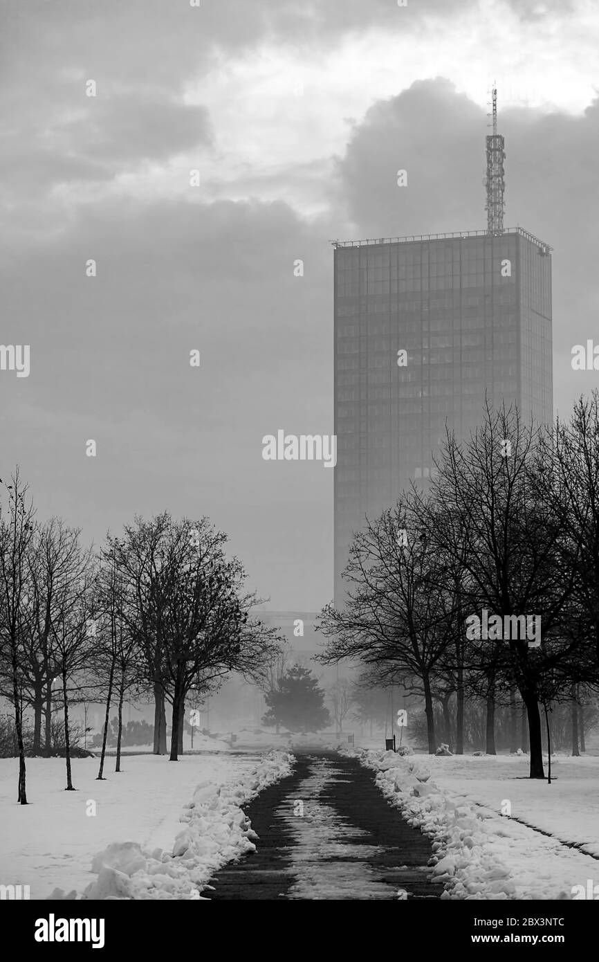 Clean road during a Snowy night with building in a mist. Belgrade ...