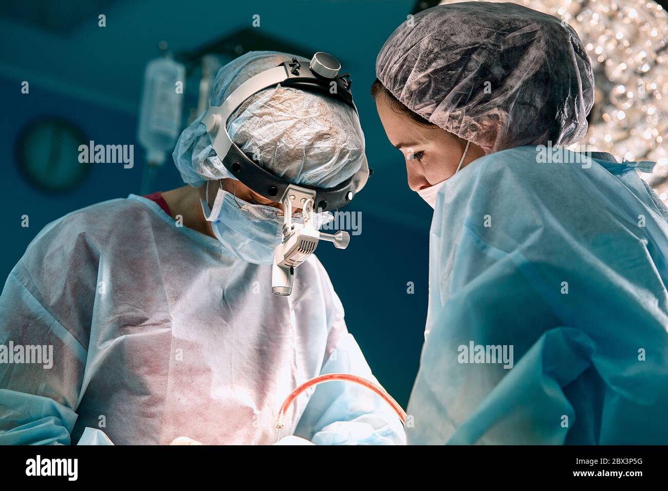 Close-up Shot in the Operating Room, Assistant Hands out Instruments to ...