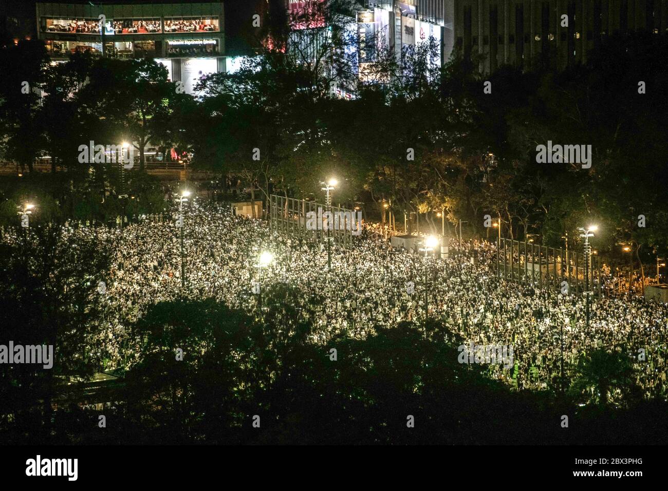 Pro-democracy protesters gather at Victoria Park during a memorial ...