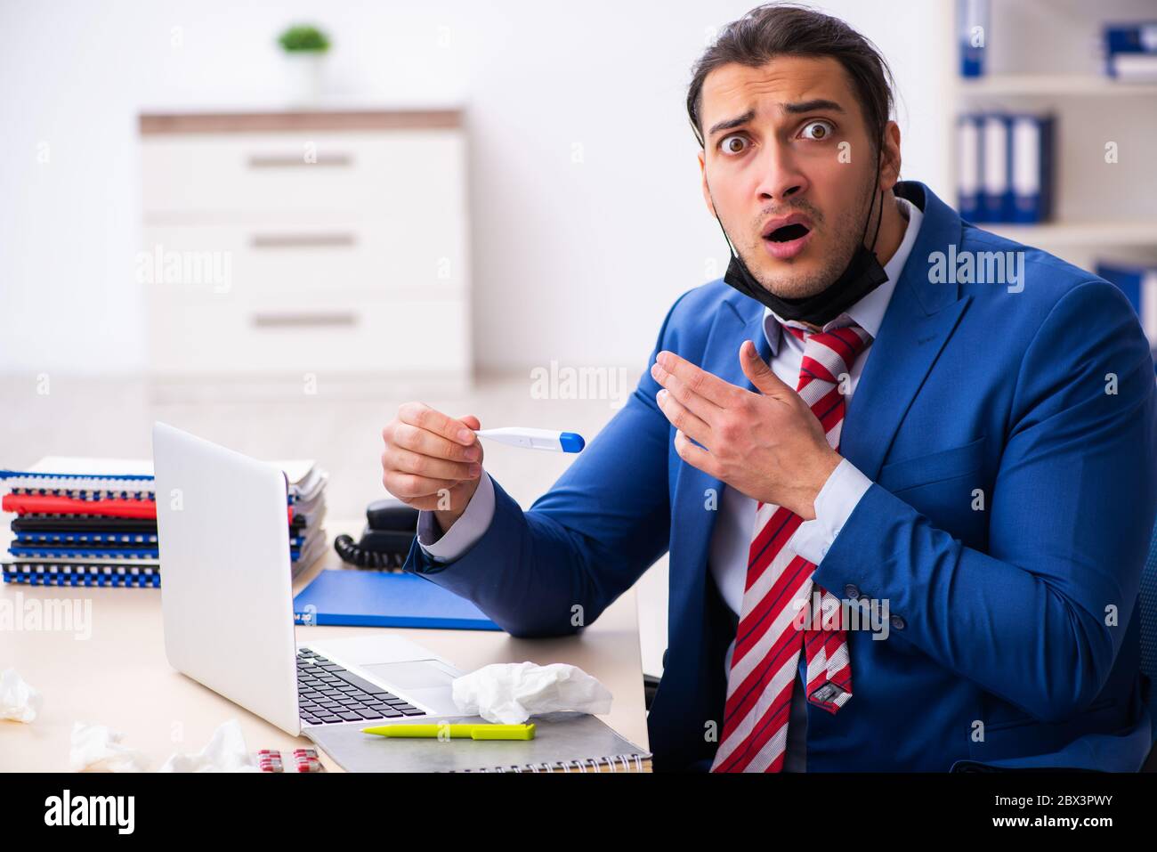 Sick employee suffering at workplace from covid-19 Stock Photo - Alamy