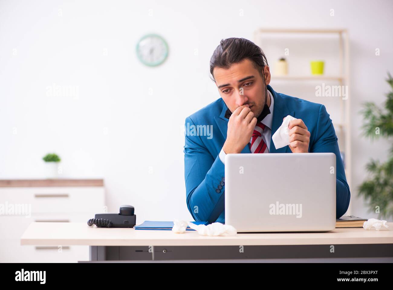 Sick employee suffering at workplace from covid-19 Stock Photo - Alamy