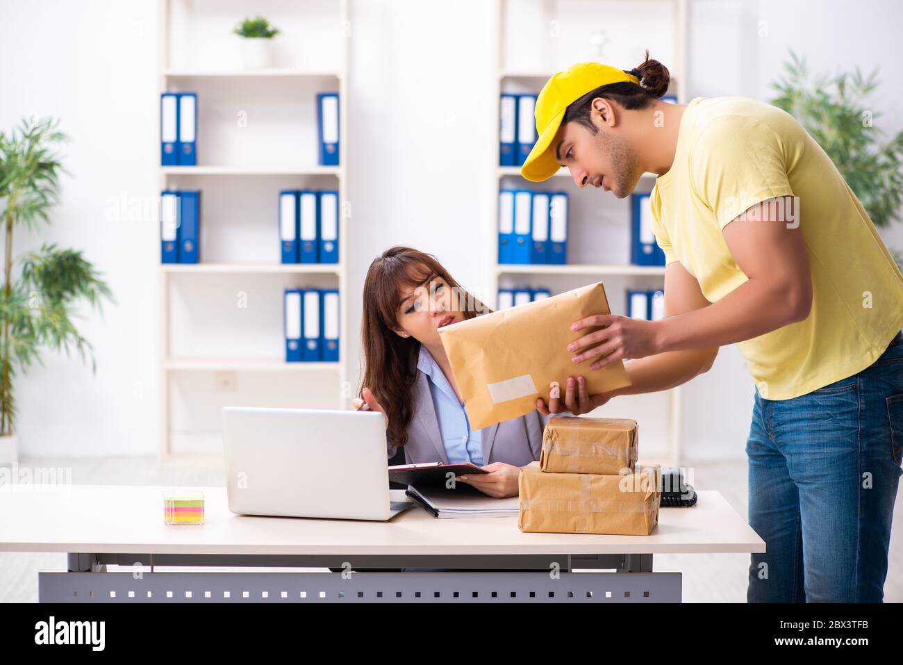 Guy holding package mailbox hi-res stock photography and images - Alamy