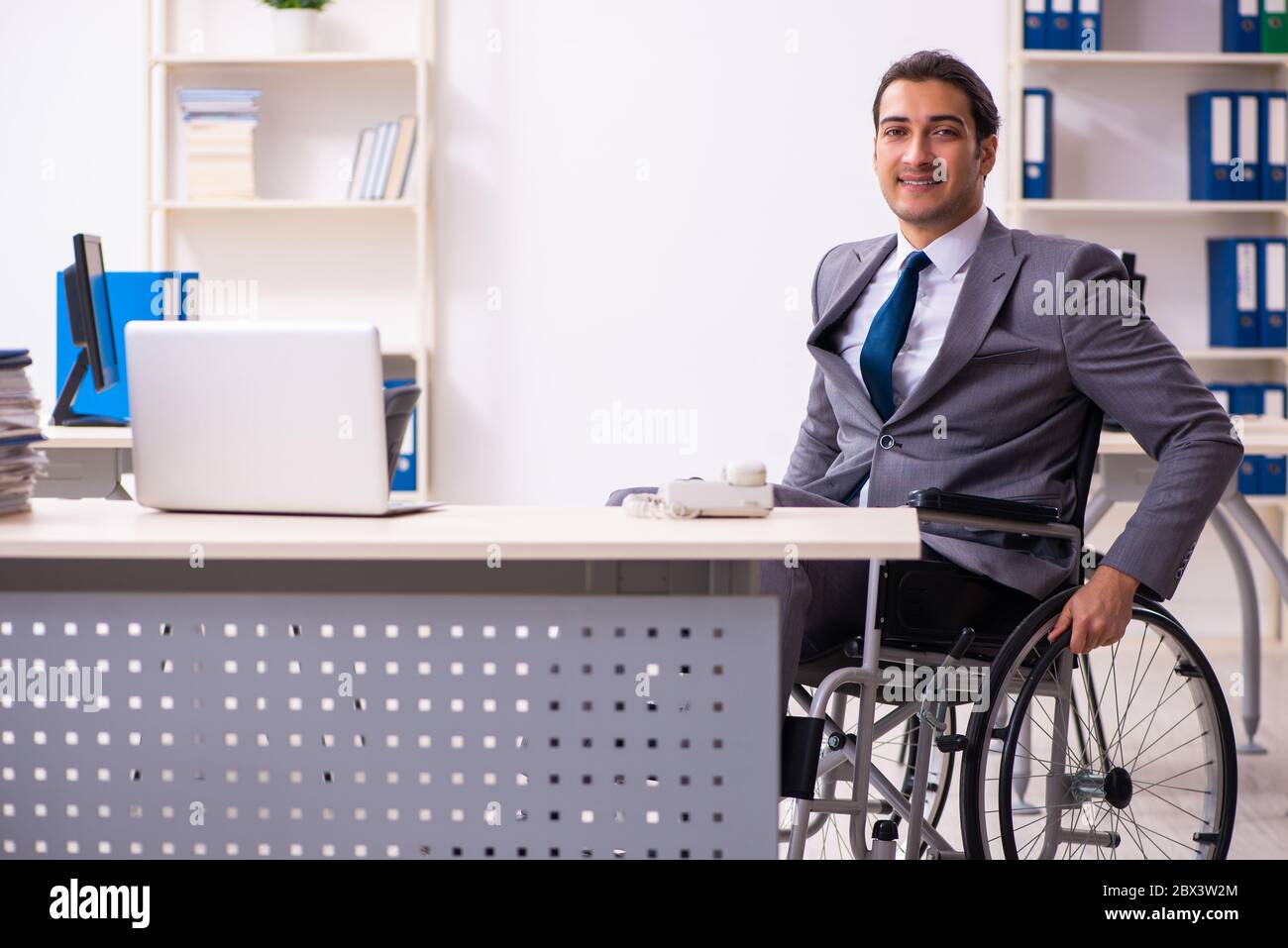 Disabled employee in the office environment Stock Photo - Alamy