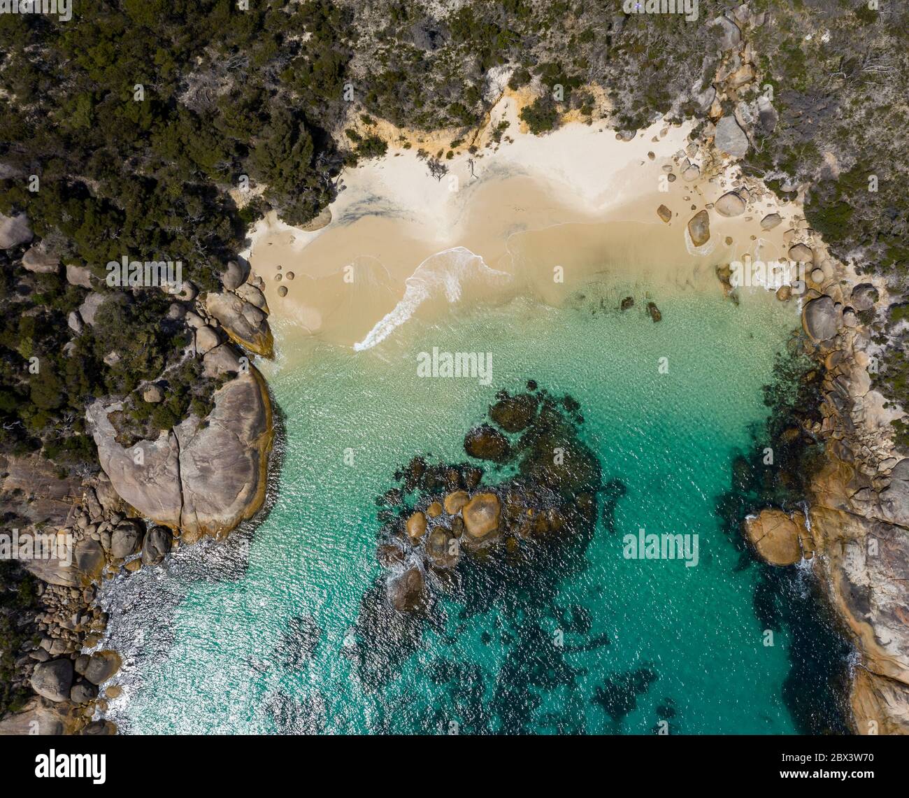 Overhead view of Waterfall Beach, a secluded beach next to the more ...