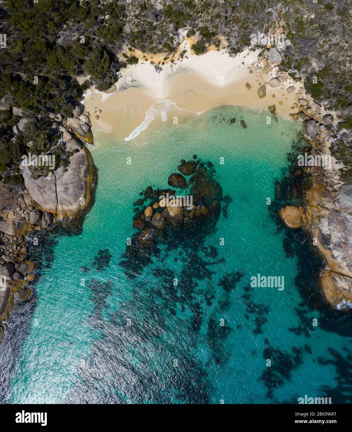 Overhead view of Waterfall Beach, a secluded beach next to the more ...