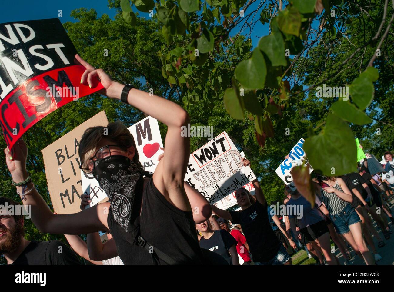 Manhattan, Kansas, USA. 3rd June, 2020. HANNAH FUNK, left, marches ...