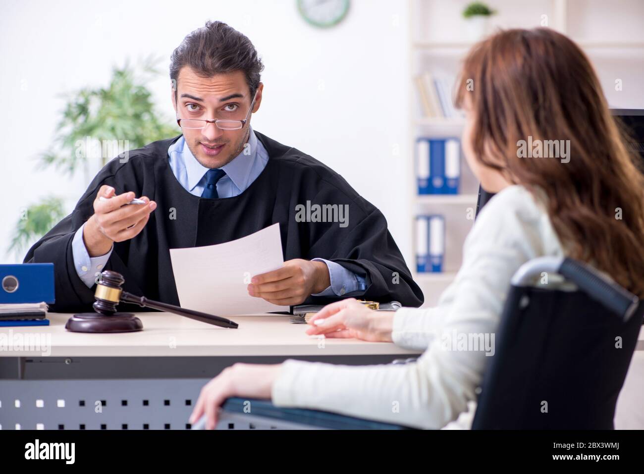Injured woman and judge in the courtroom Stock Photo - Alamy