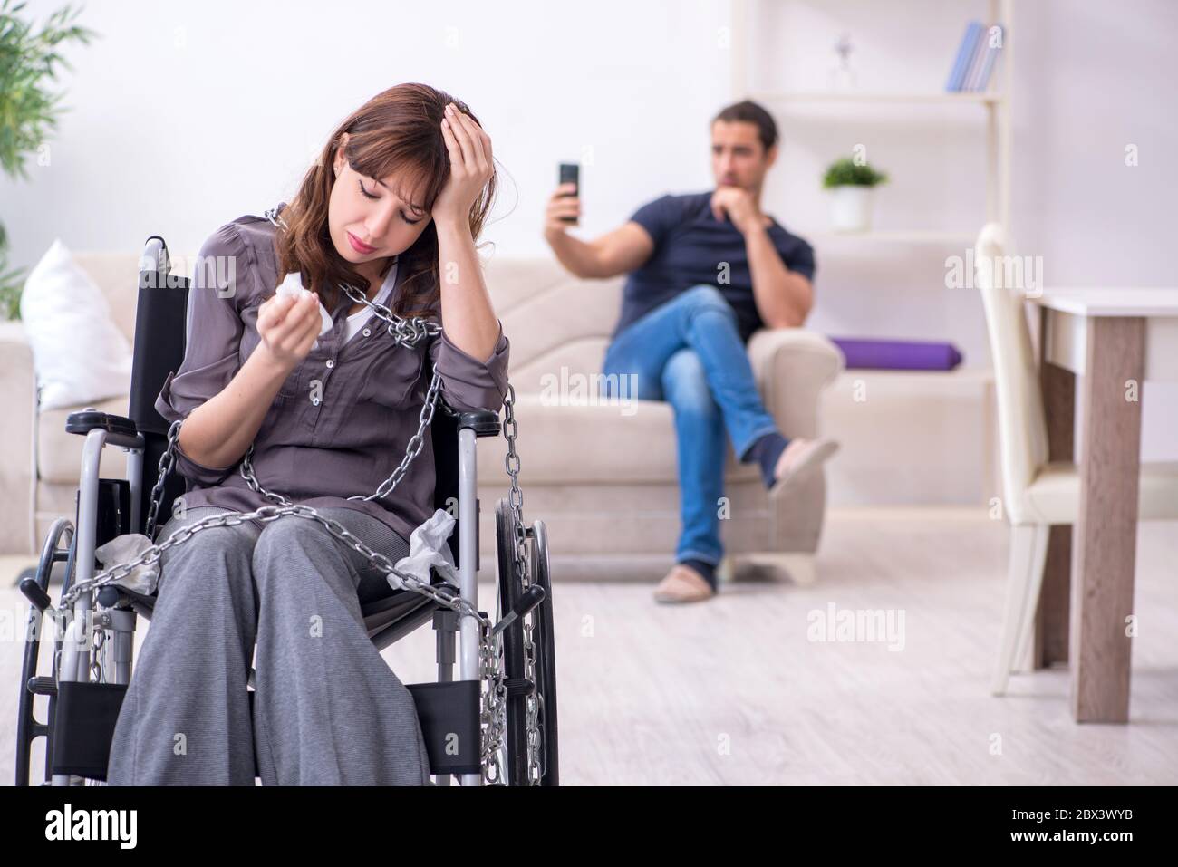 Disabled wife and husband at home Stock Photo - Alamy