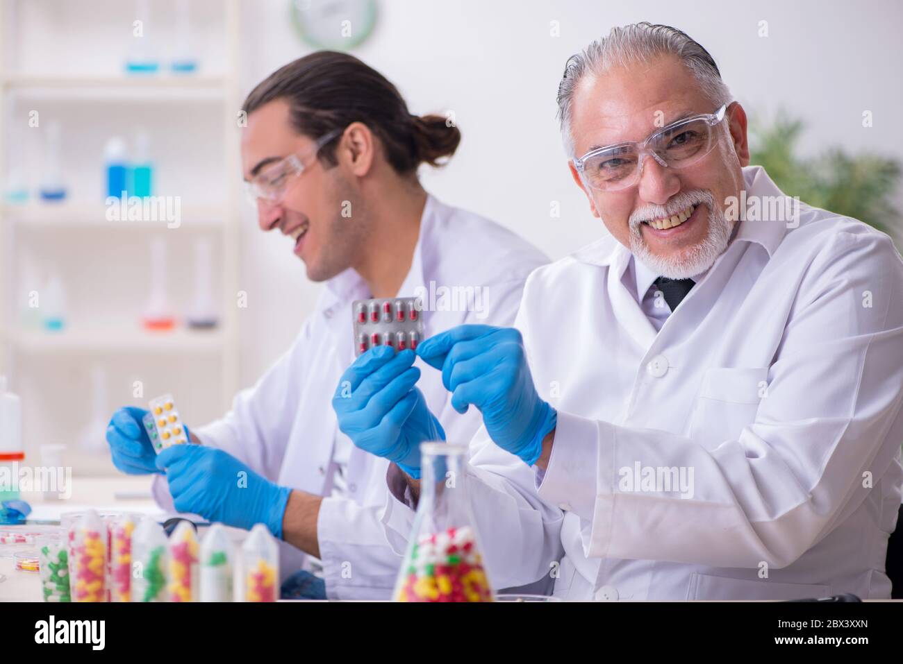 Two chemists working in the laboratory Stock Photo - Alamy