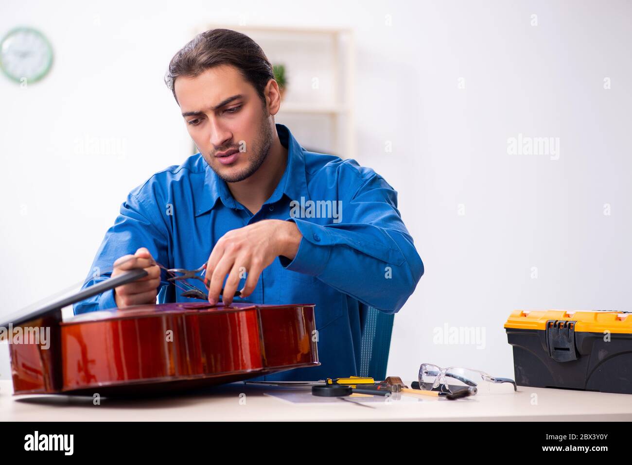 Cello repair hi-res stock photography and images - Alamy