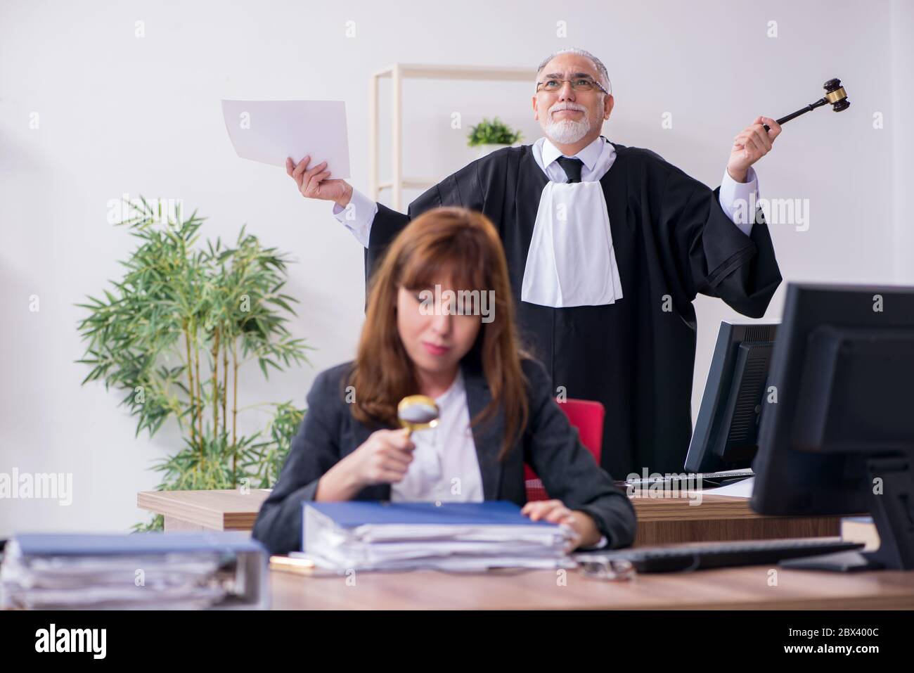 Old judge and his young secretary in the office Stock Photo - Alamy