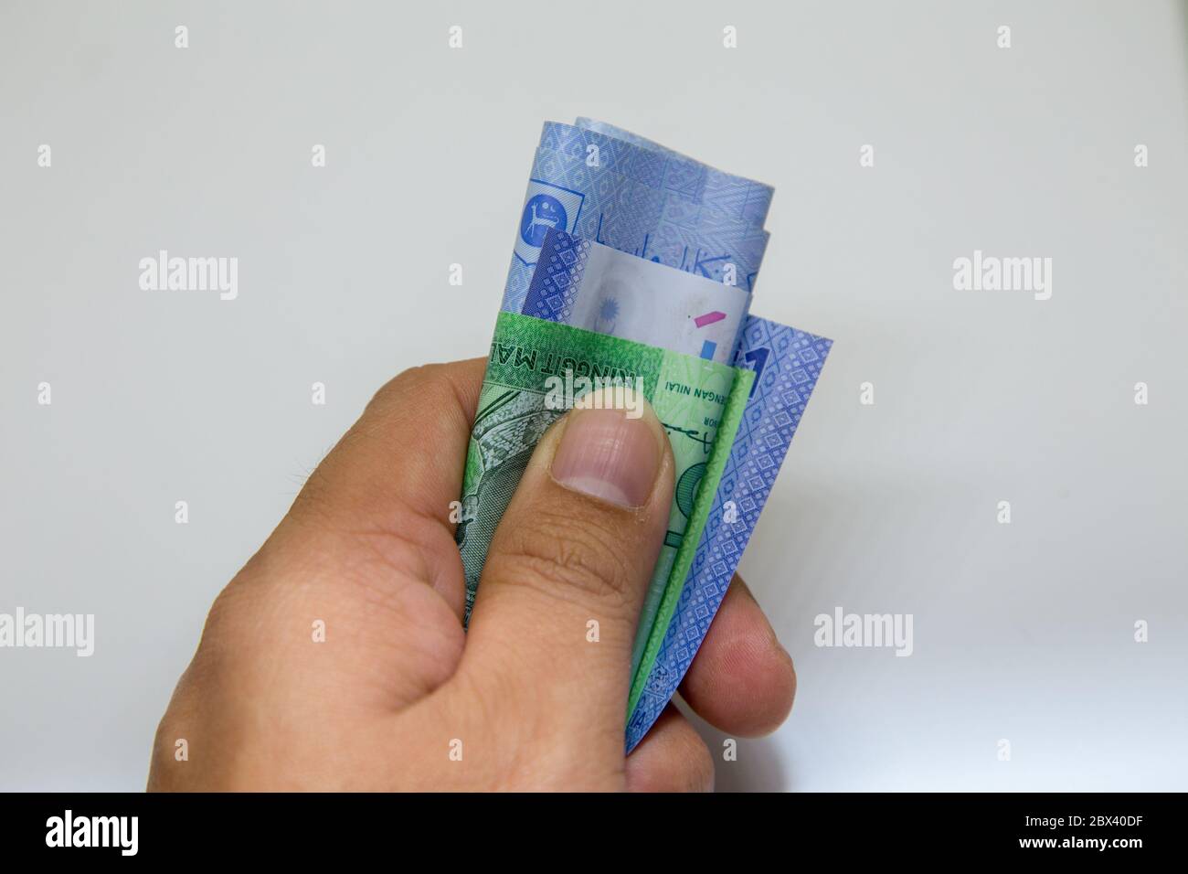 A hand grab a money Ringgit Malaysia Notes (RM)-Finance Concept Stock ...