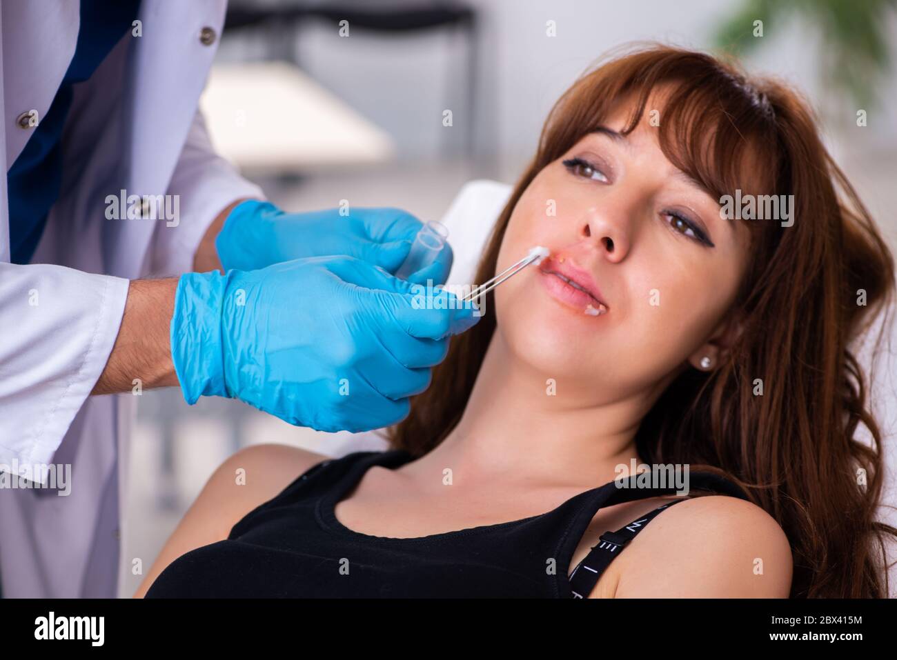 Young woman visiting doctor dermatologist Stock Photo - Alamy