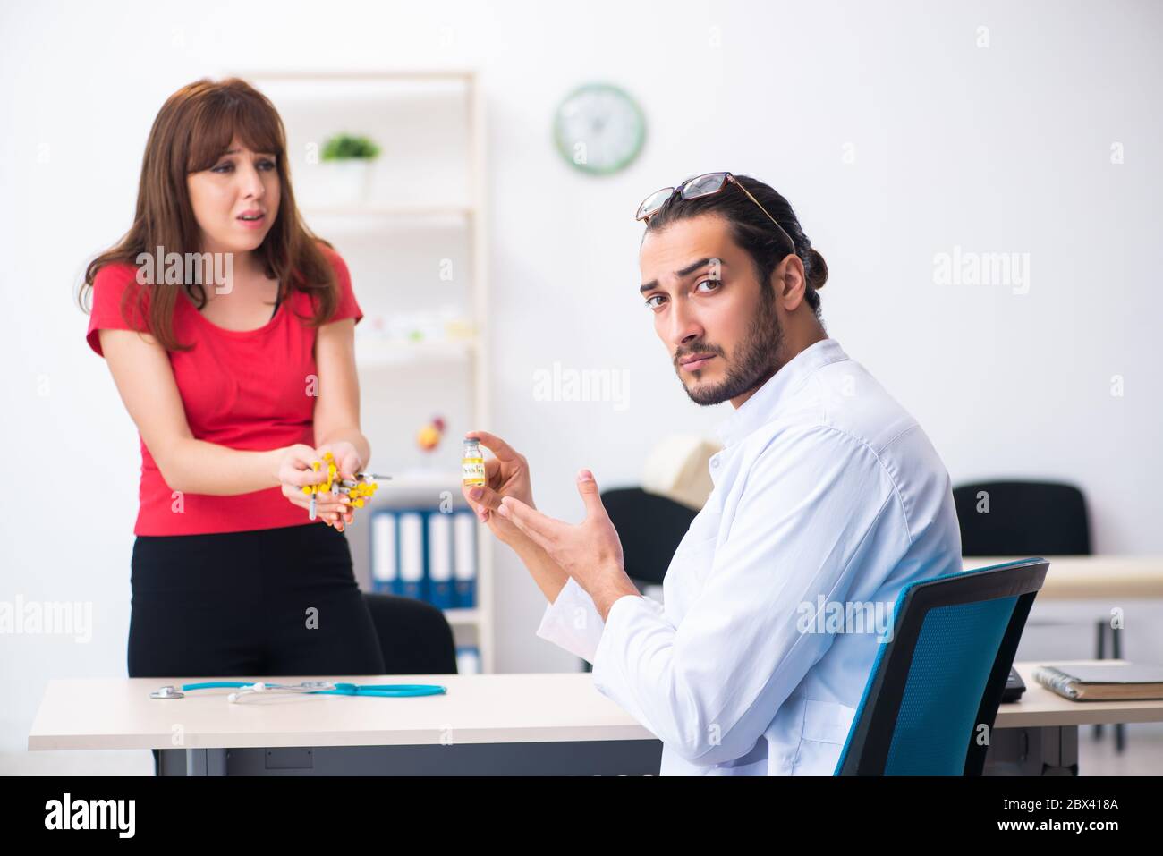Female diabetic patient visiting young doctor Stock Photo - Alamy