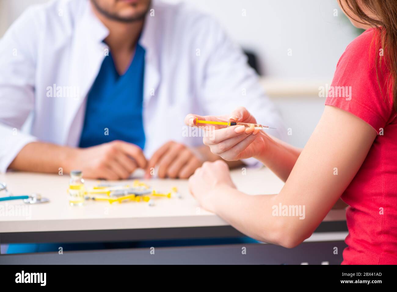 Female diabetic patient visiting young doctor Stock Photo - Alamy
