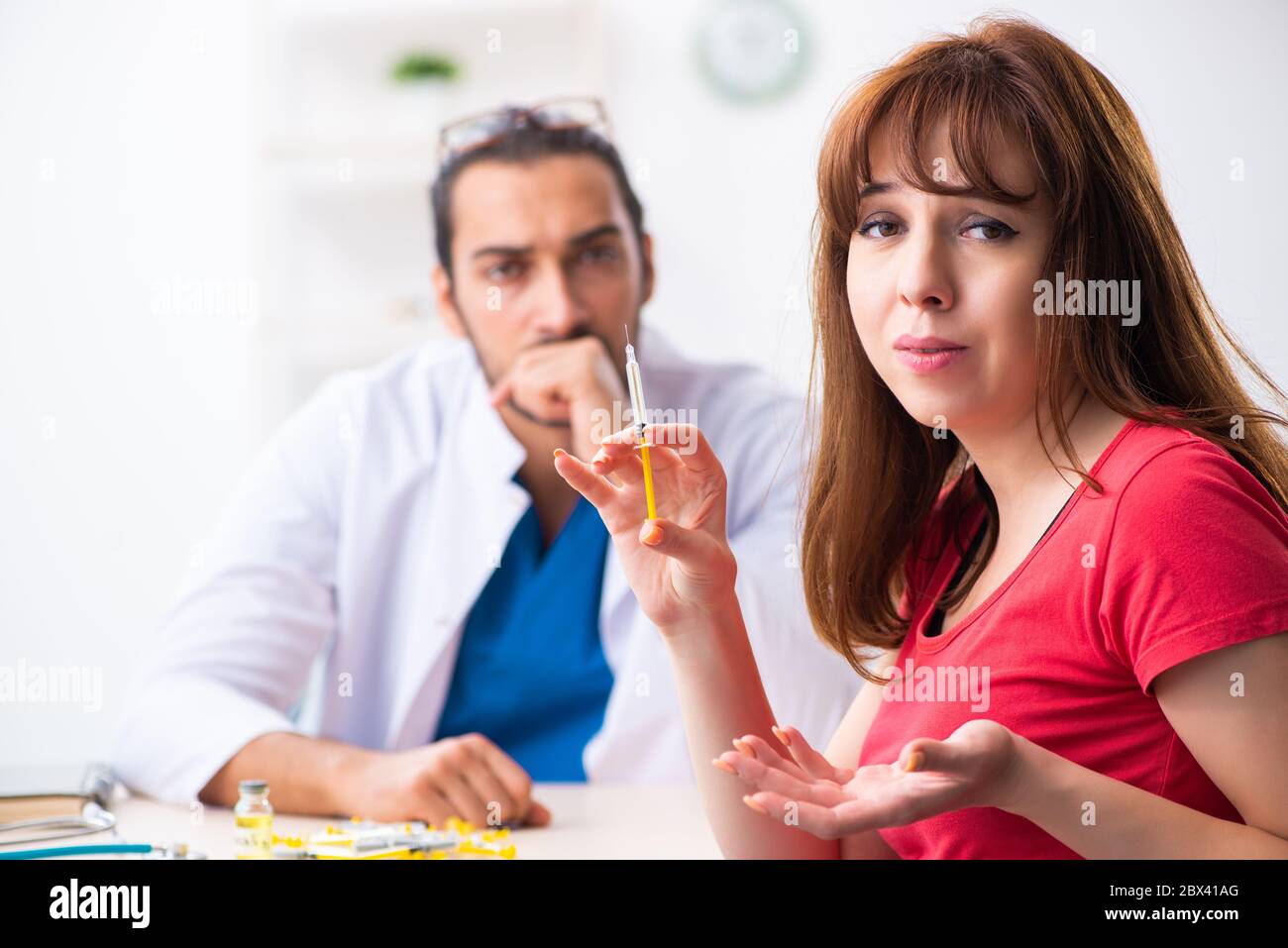 Female diabetic patient visiting young doctor Stock Photo - Alamy