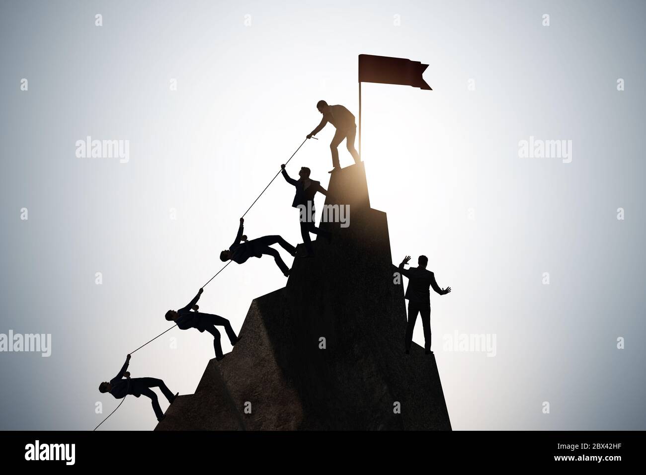 Concept of teamwork with team climbing mountain Stock Photo - Alamy