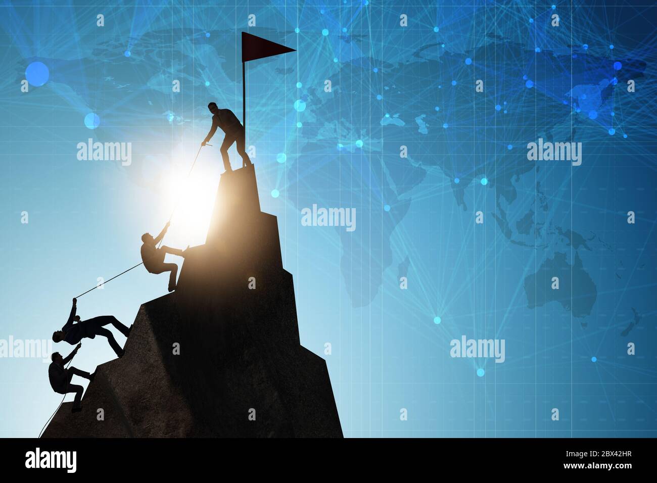 Concept of teamwork with team climbing mountain Stock Photo - Alamy