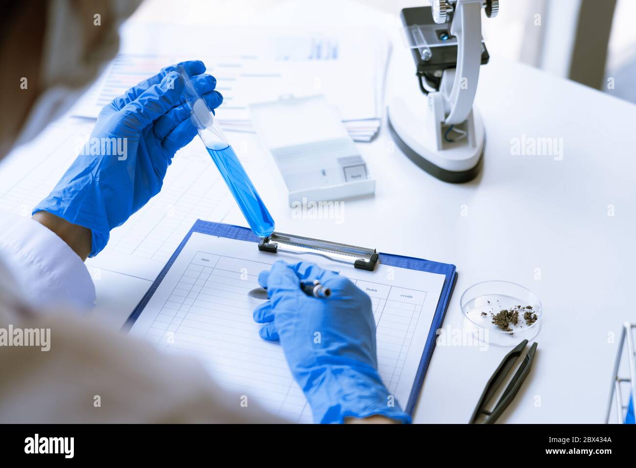 Scientist wear lab coat and protective wear are working with research ...