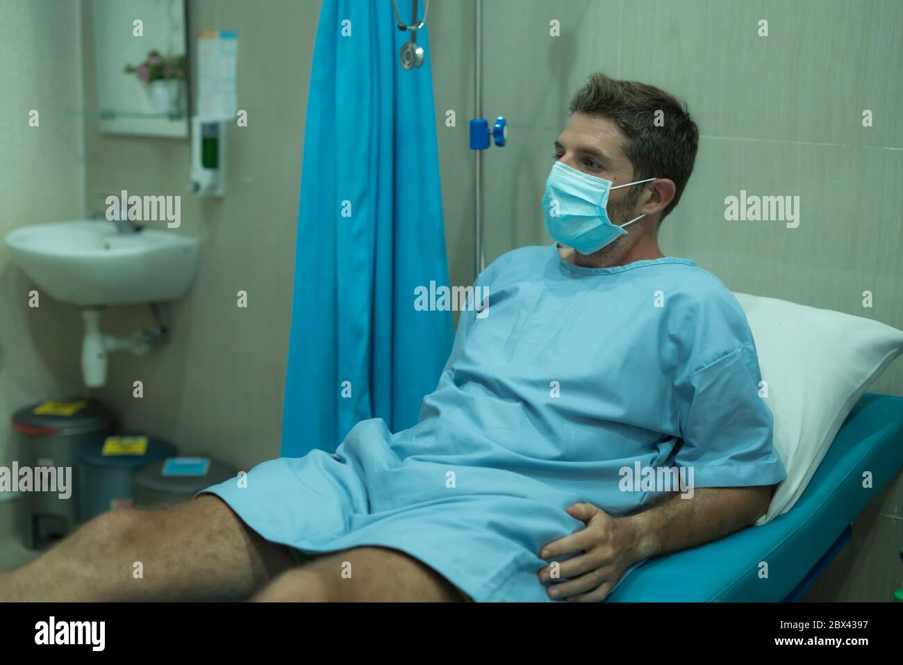 attractive and scared man infected by covid-19 - dramatic portrait of ...