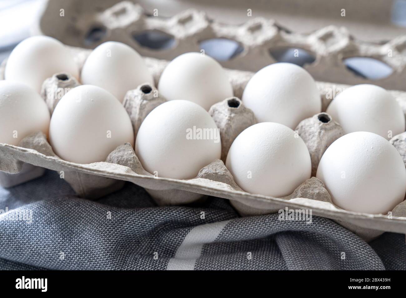 Twelve eggs in a carton package Stock Photo - Alamy