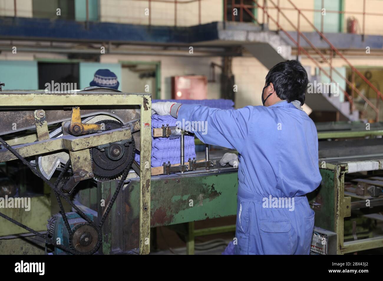 man at work in a factory Stock Photo - Alamy