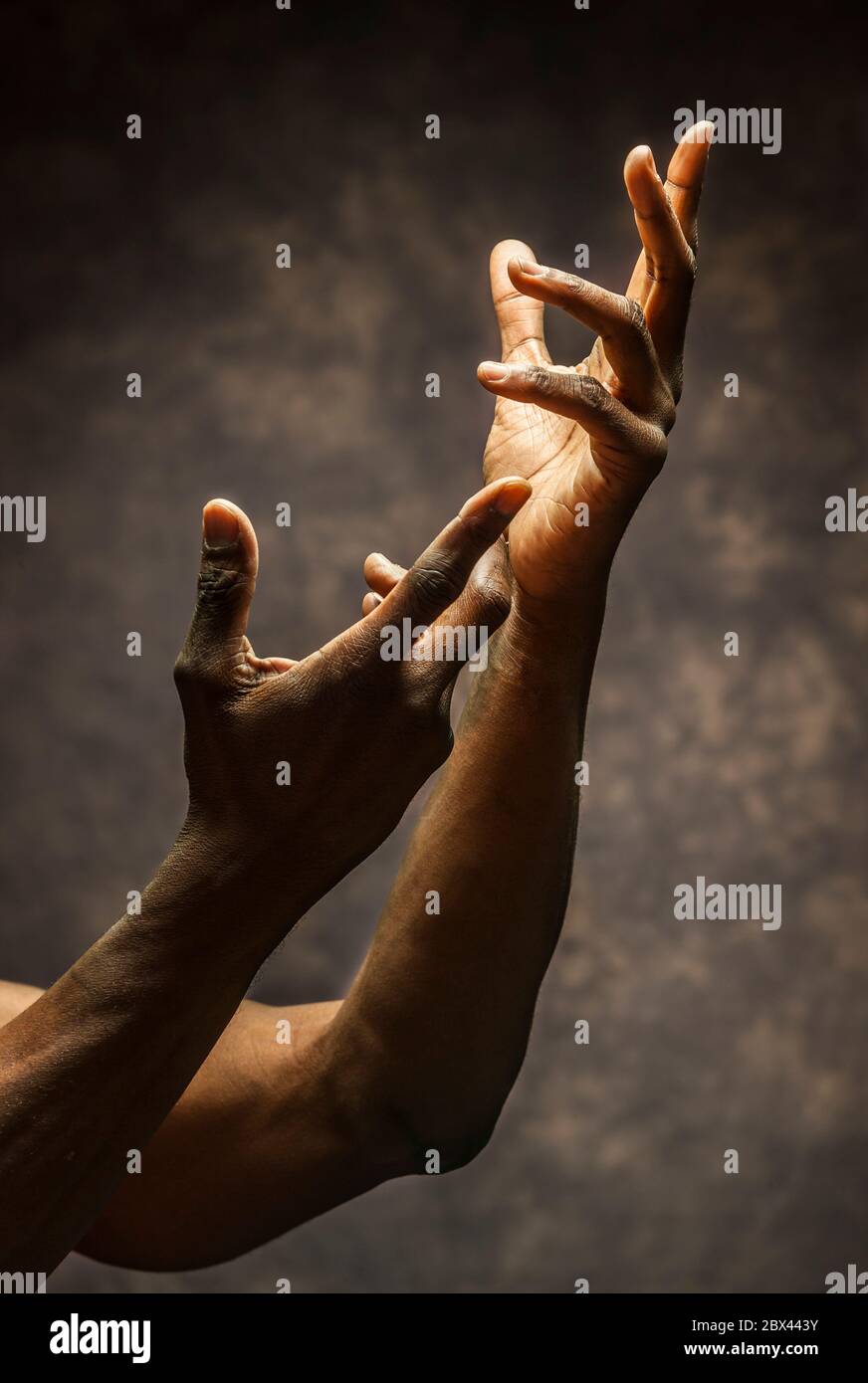 A pair of African American / black hands and arms in various positions ...