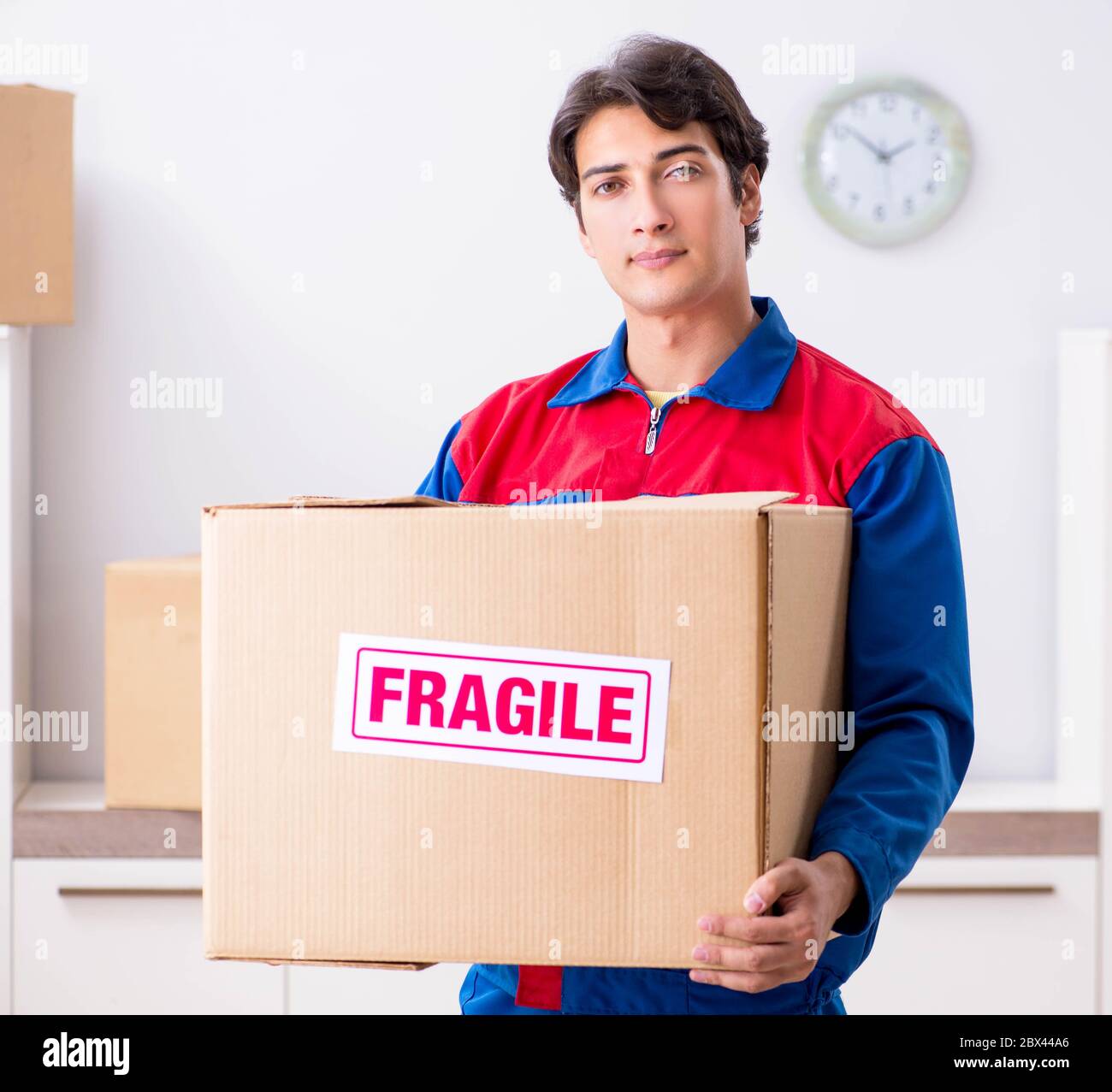 The transportation contractor with fragile boxes Stock Photo - Alamy
