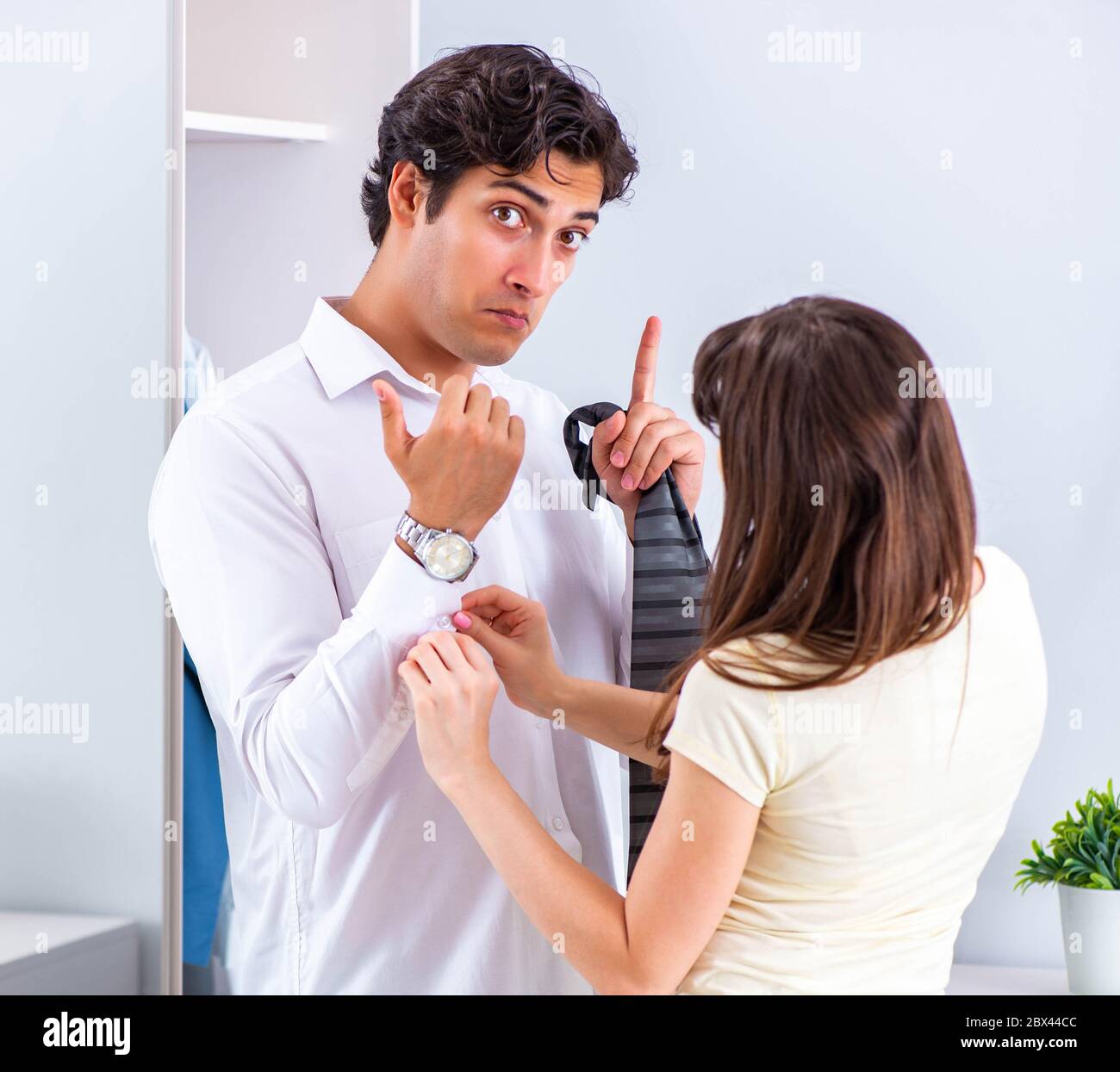 The woman sees her husband off to work Stock Photo - Alamy