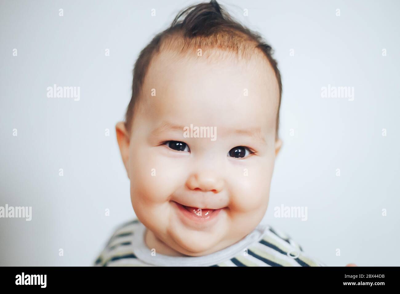 Happy Kazakh baby girl kid russian mother and kazakh father half-breed ...