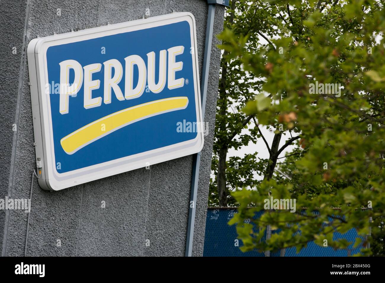 A logo sign outside of a Perdue Farms poultry processing plant in ...