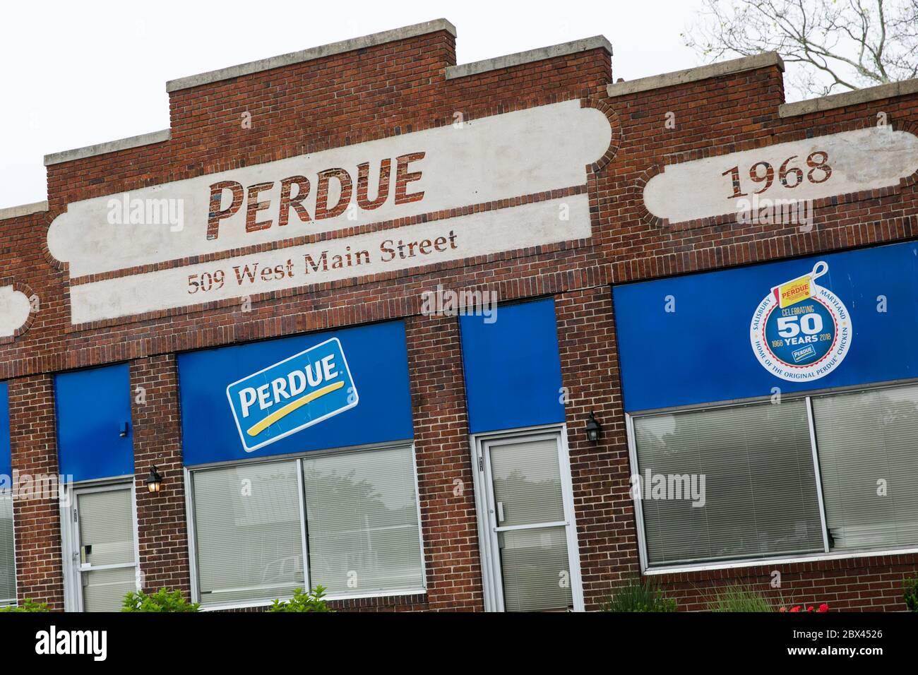 A logo sign outside of a Perdue Farms poultry processing plant in ...