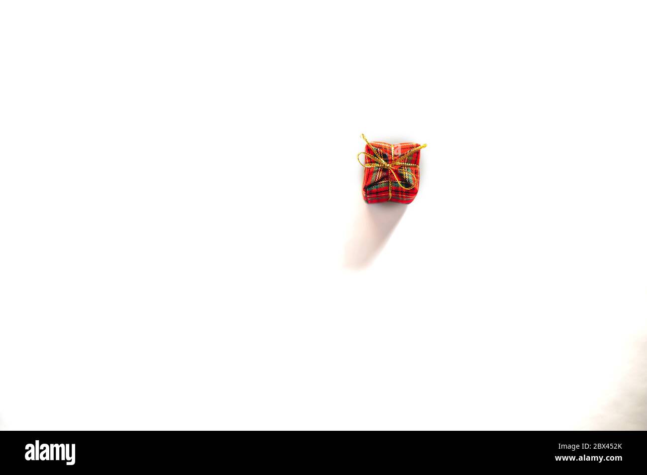 red small Gift box with red ribbon on white background Stock Photo - Alamy